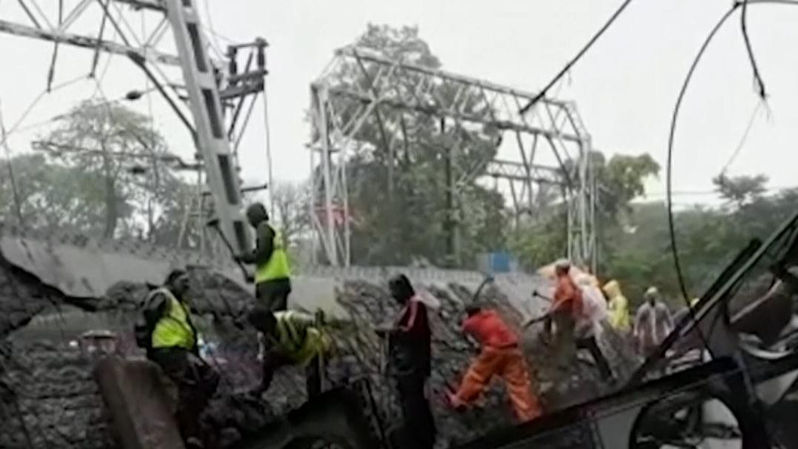 Mumbai bridge collapses onto train tracks | World News | Sky News