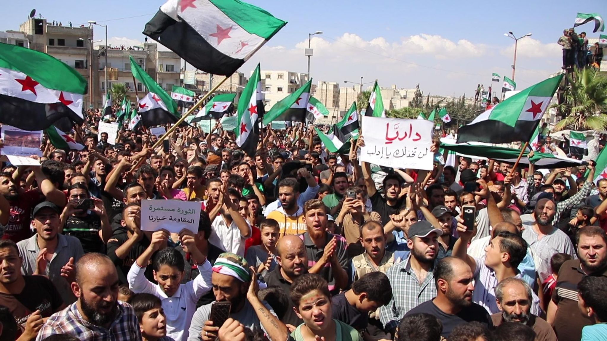 Syria conflict: Idlib's residents protest in rebel stronghold amid ...