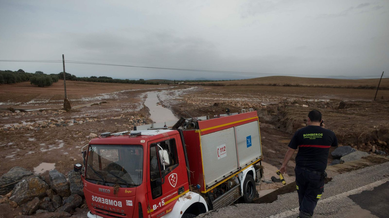 Firefighter dies after truck overturns in flash floods in southern ...