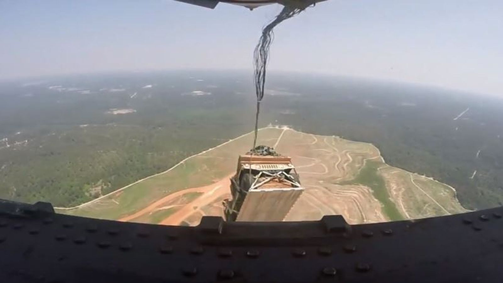 Humvee dropped from US plane lands in back garden - seven miles from ...