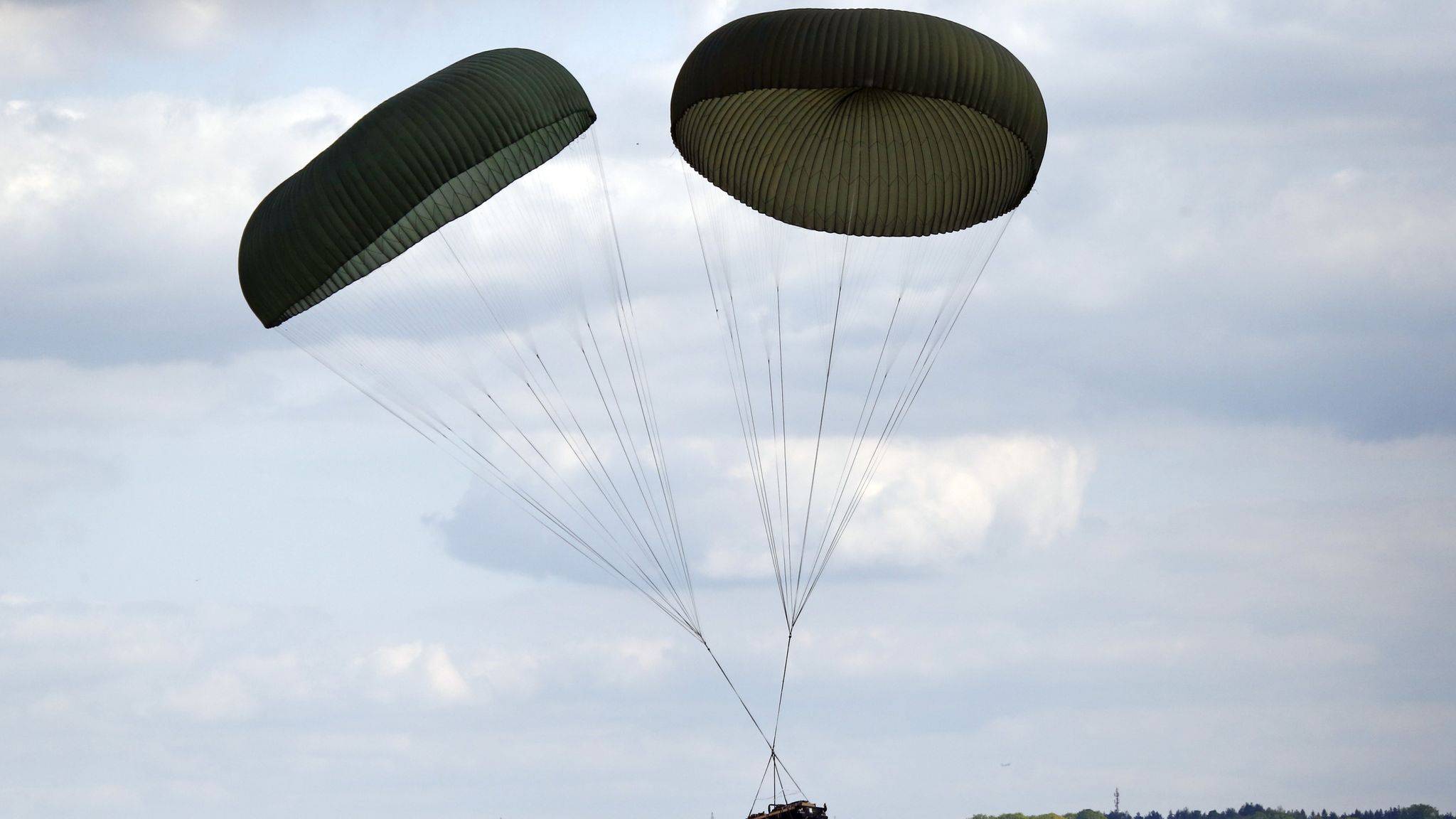 Humvee dropped from US plane lands in back garden - seven miles from ...