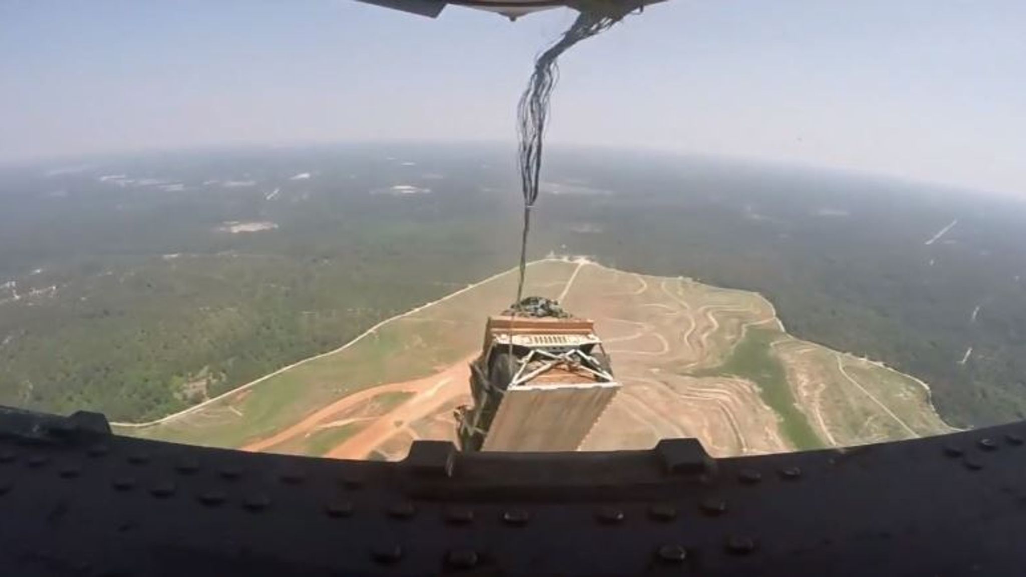 Humvee dropped from US plane lands in back garden - seven miles from ...