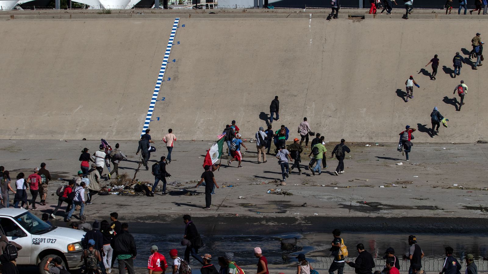 Migrants rushing US border hit with tear gas | World News | Sky News