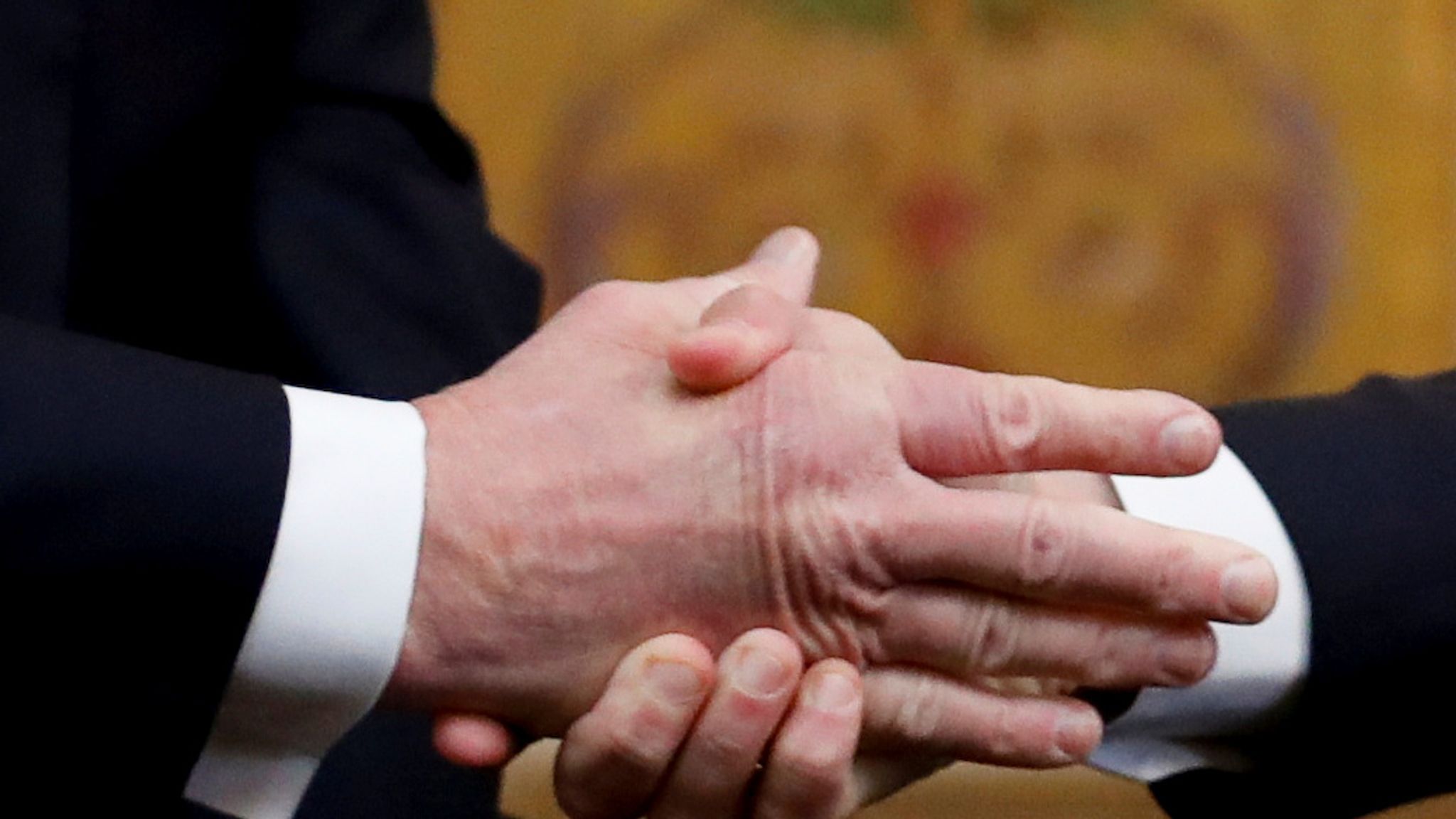 Donald Trump and Emmanuel Macron in frosty meeting after French leader ...