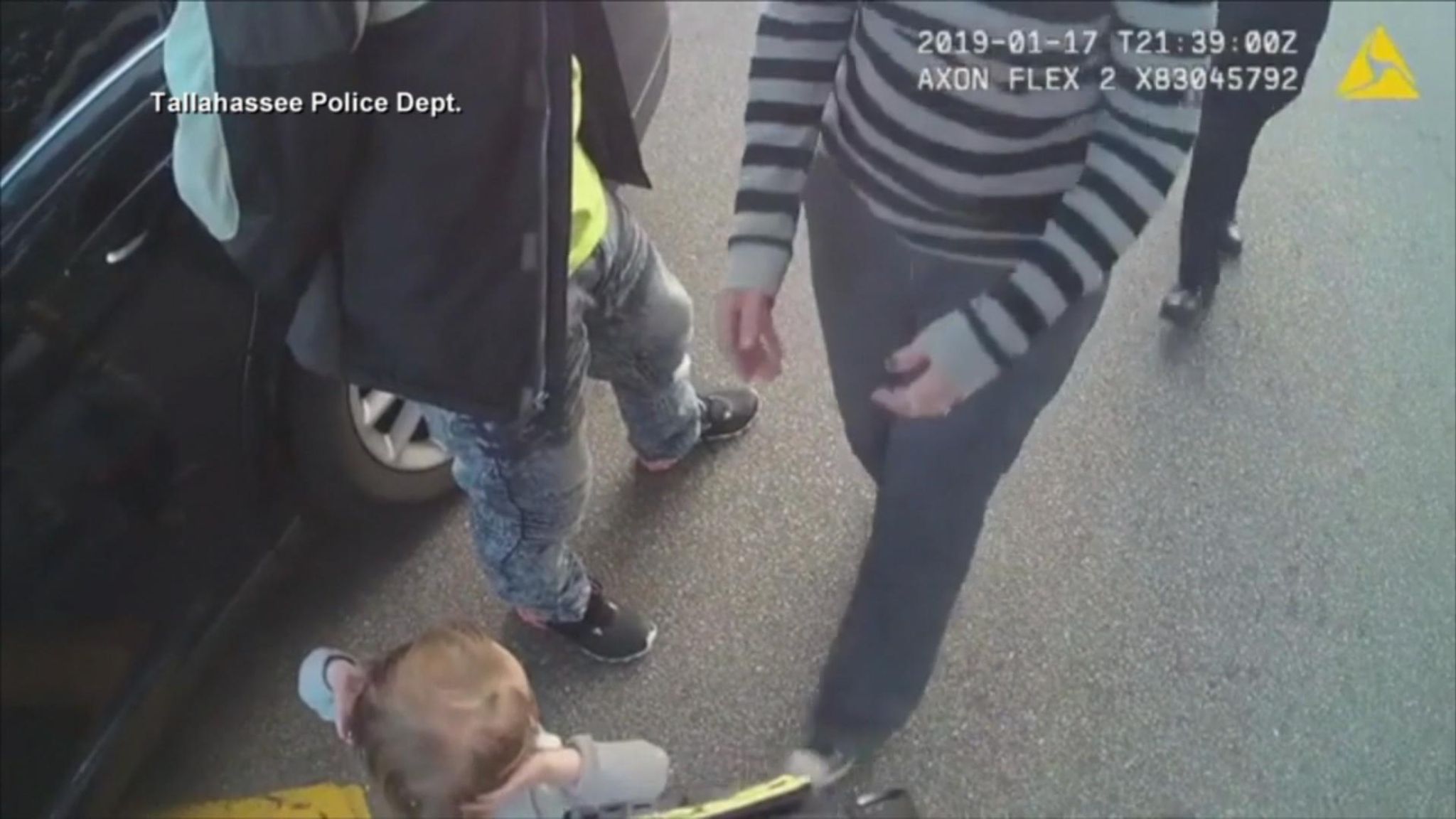 Toddler walks towards armed police during arrest of suspected ...
