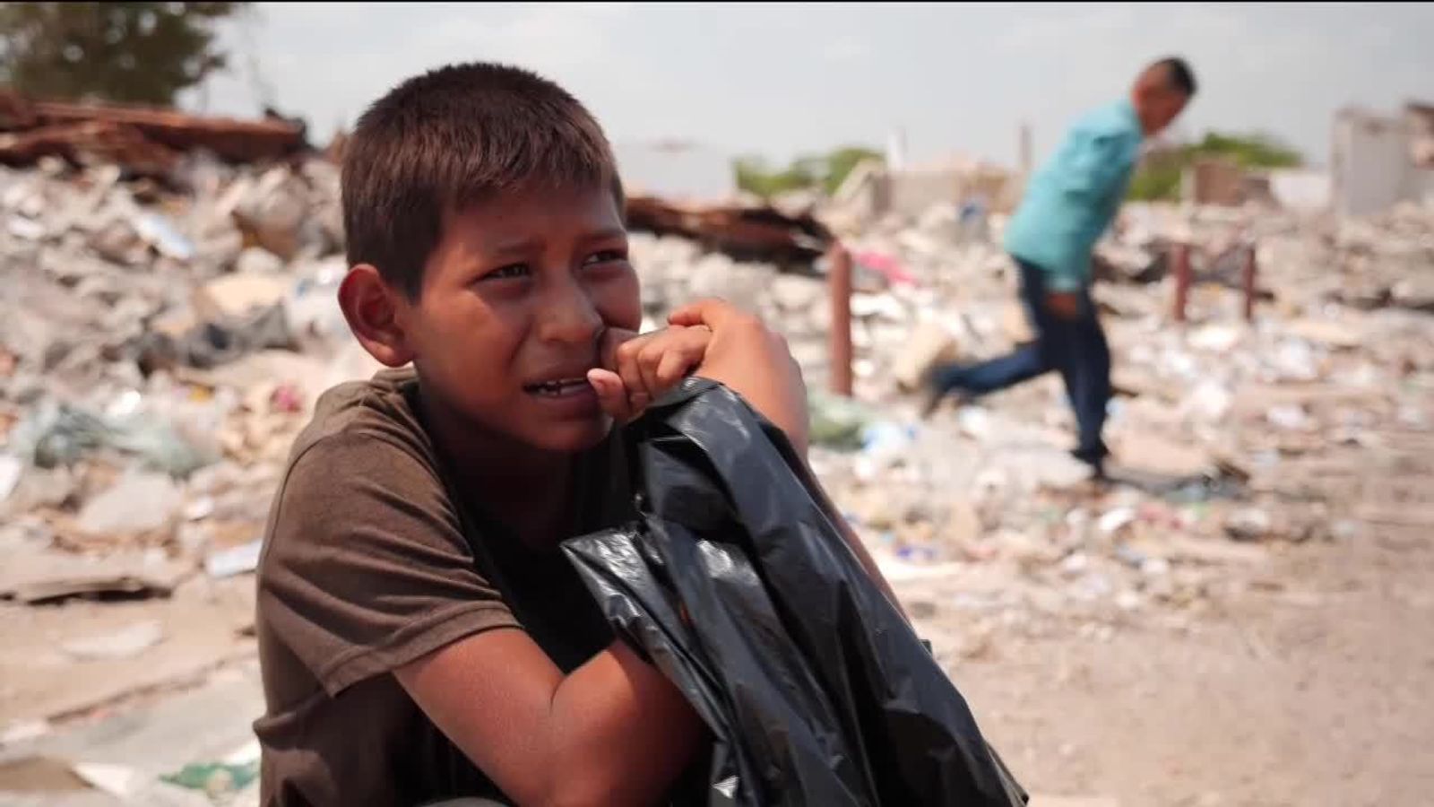 Venezuelan children search for food in dump | World News | Sky News