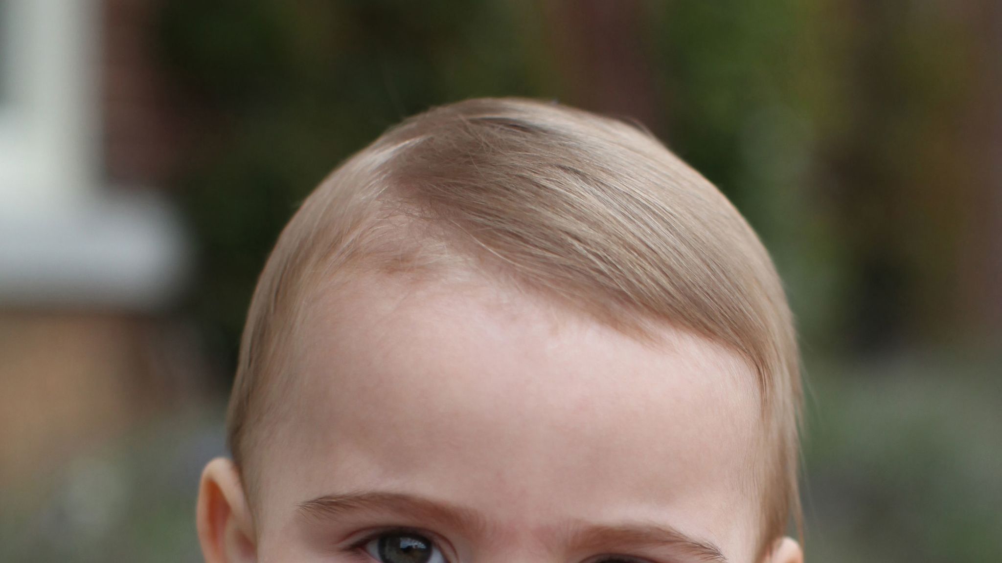 Toothy grin: New pics of Prince Louis to mark his first birthday | UK ...