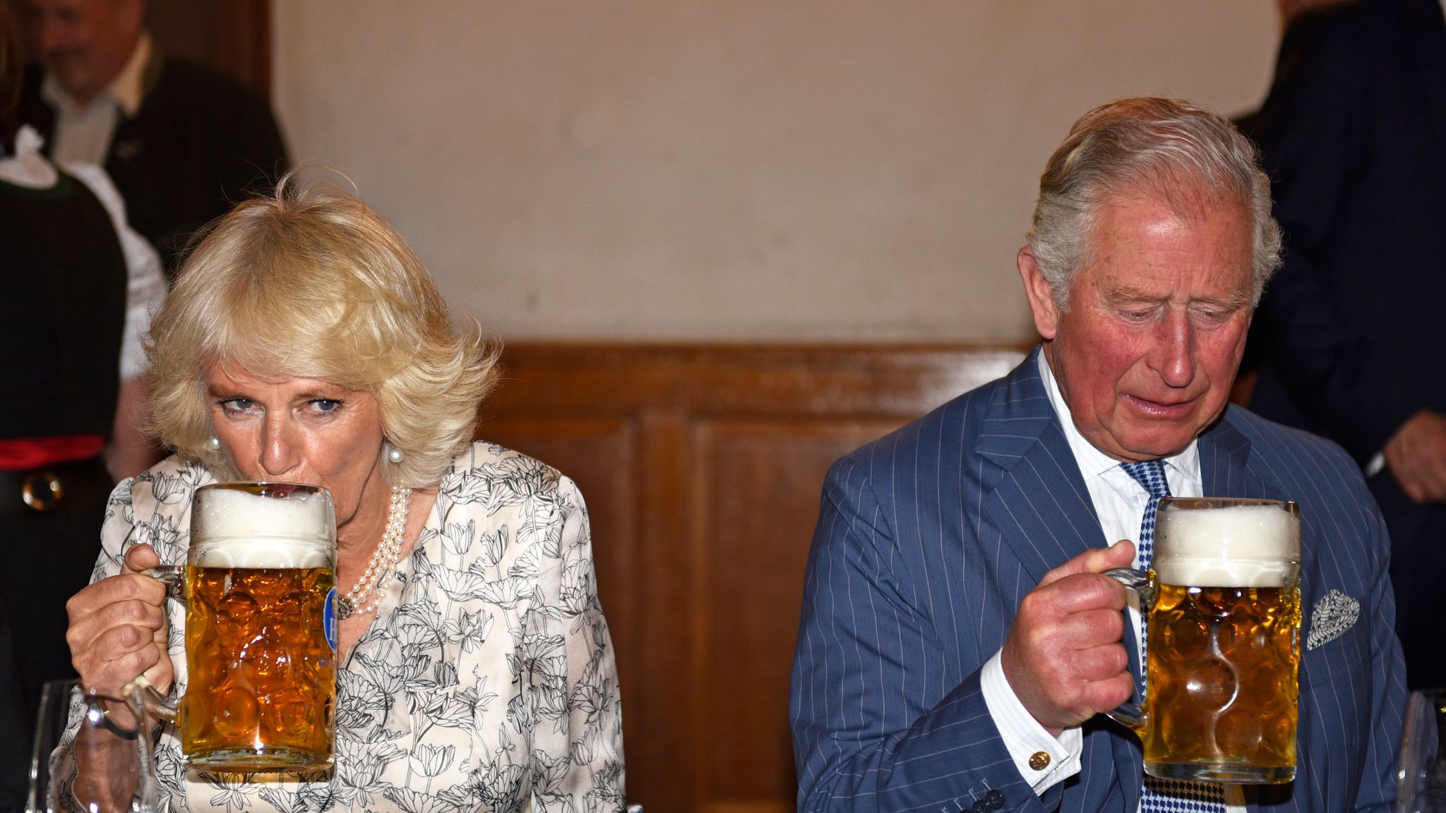 To Archie! Charles and Camilla celebrate with beer on tour in Germany ...
