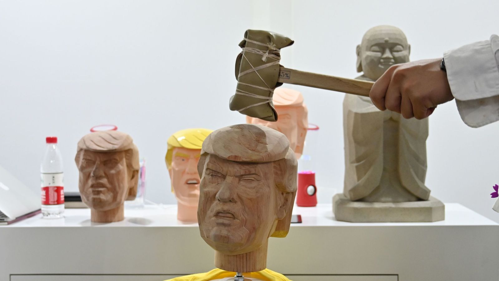 'Stress relief' booth where visitors strike Donald Trump bobble-head ...