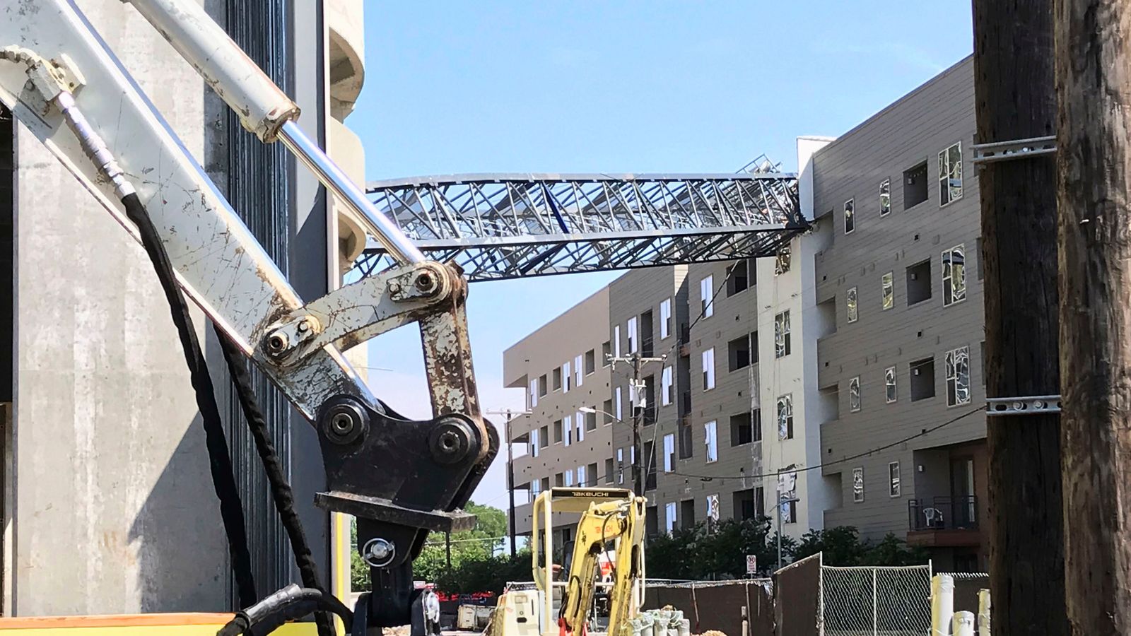 Crane collapses during thunderstorm and 'slices through' apartment ...