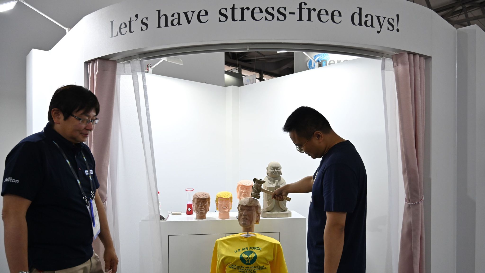 'Stress relief' booth where visitors strike Donald Trump bobble-head ...