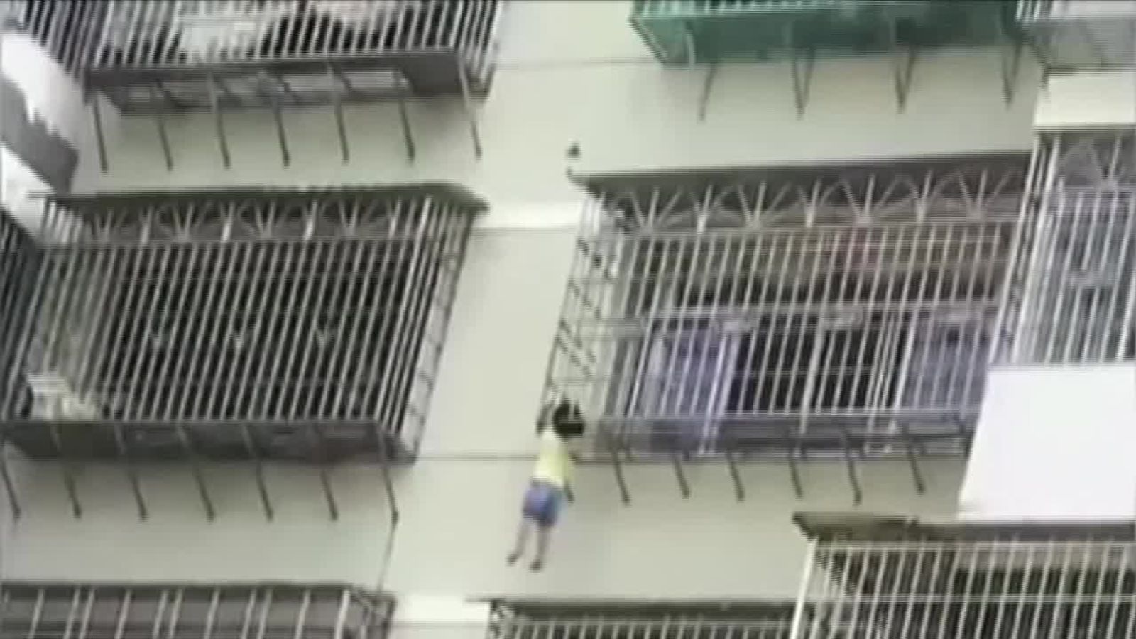 Firefighters in China rescue child hanging from building | World News ...