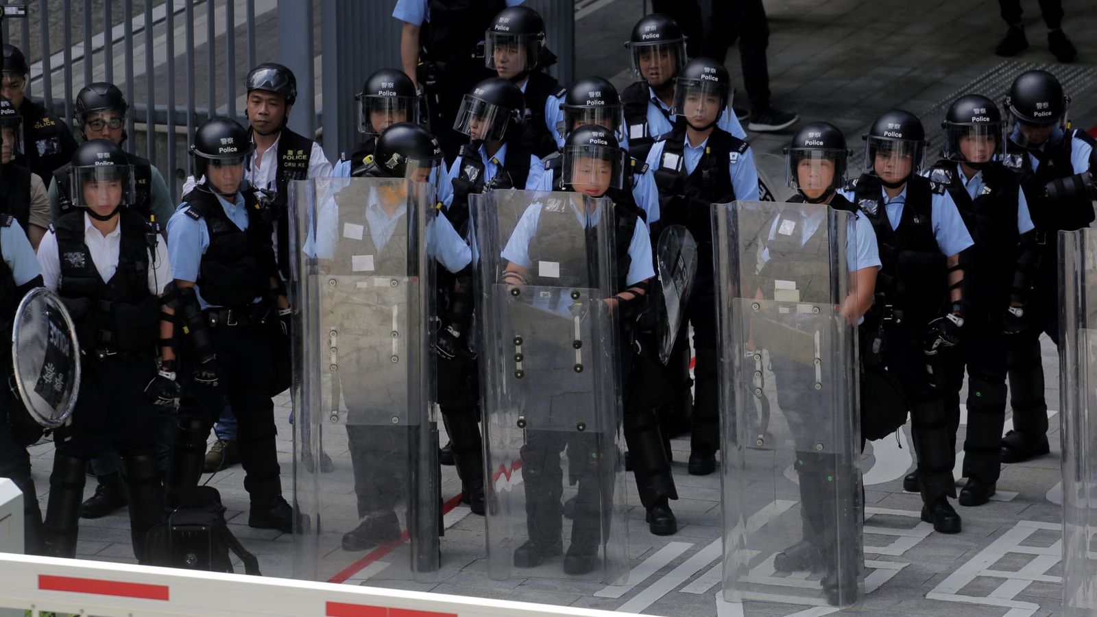Hong Kong protests: Demonstrators storm govt building on anniversary of ...