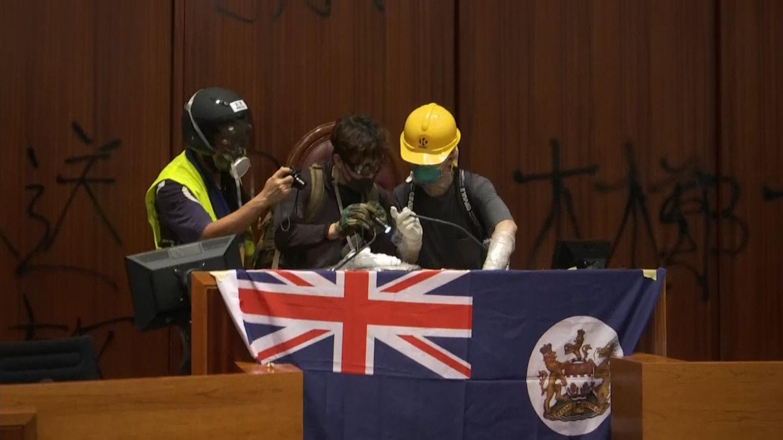 Hong Kong protests: Demonstrators storm govt building on anniversary of ...