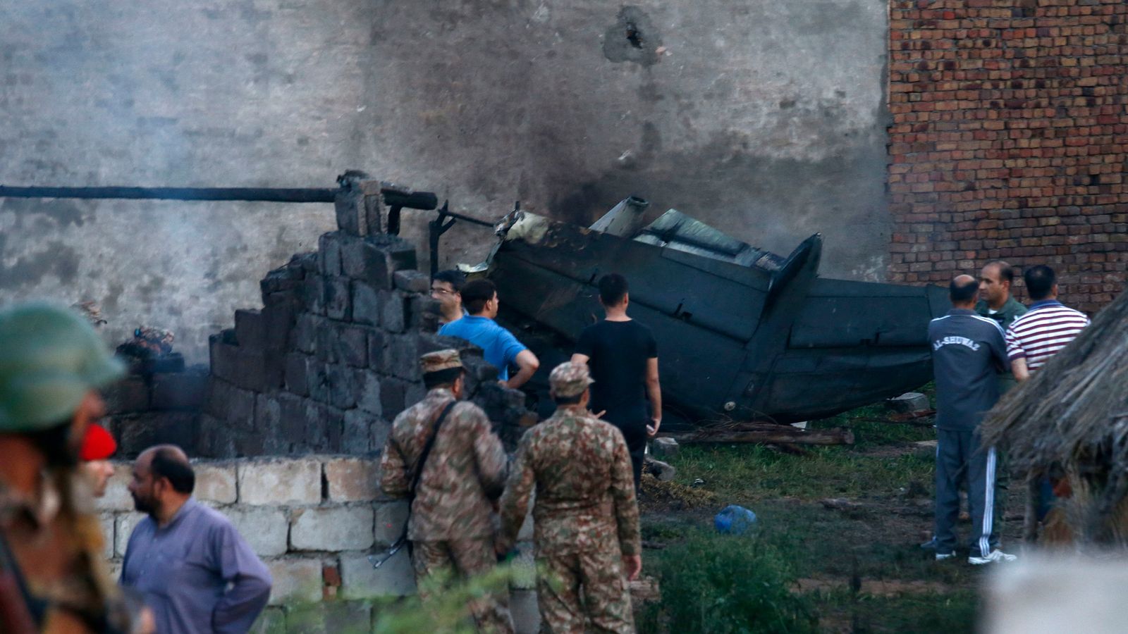 Pakistan plane: At least 17 dead as army aircraft crashes into homes in ...