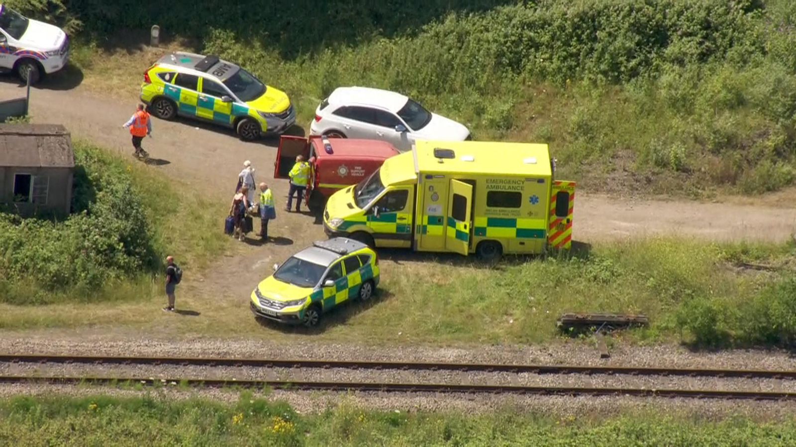 Two railway workers killed after being hit by train 'could not hear it ...
