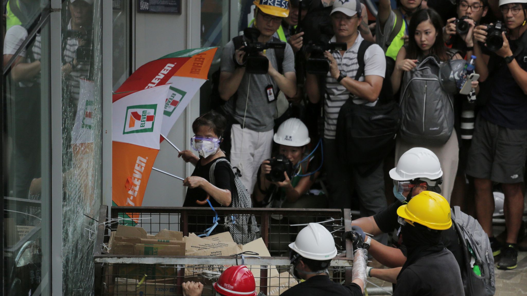 Hong Kong protests: Demonstrators storm govt building on anniversary of ...