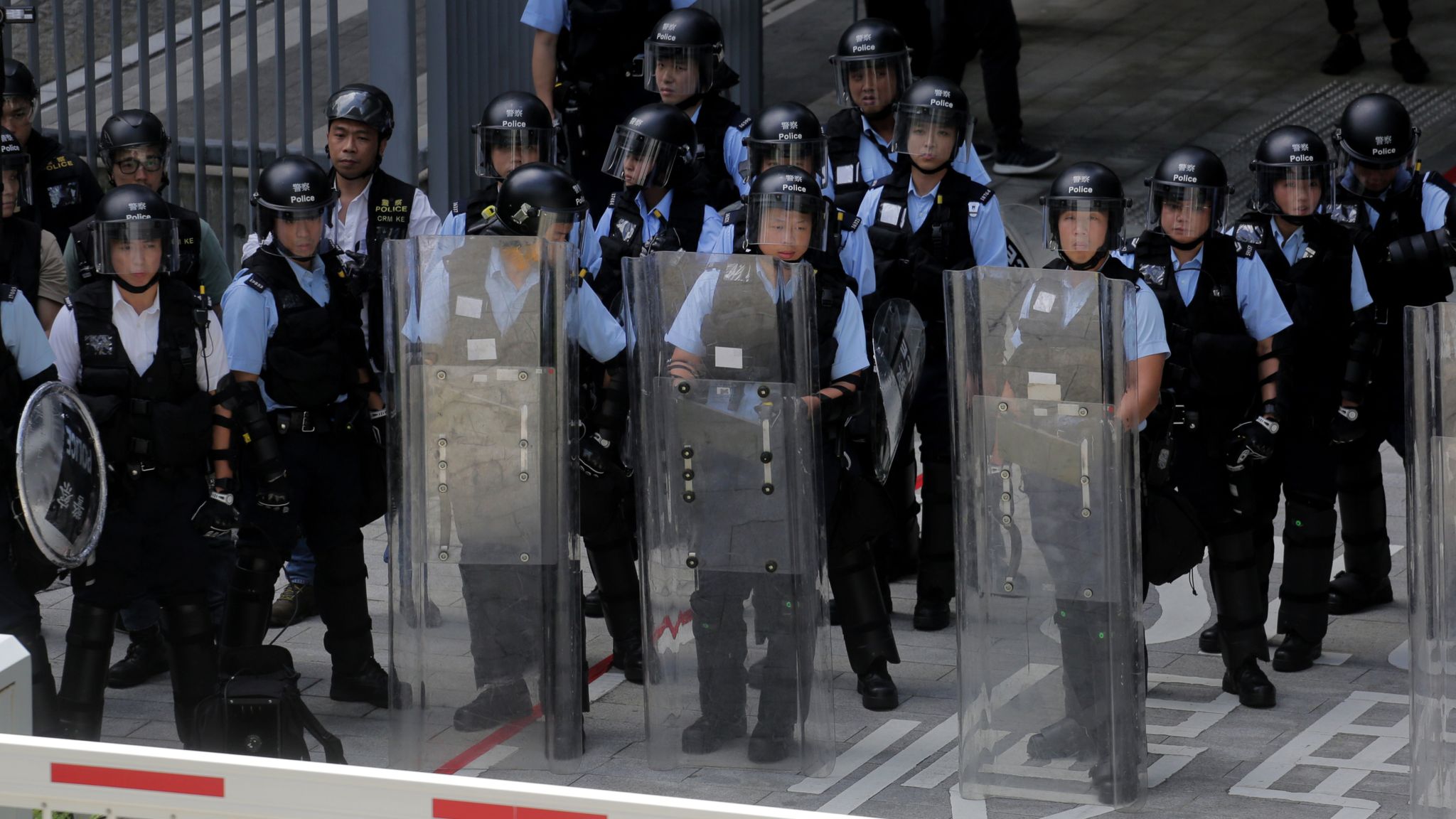 Hong Kong protests: Demonstrators storm govt building on anniversary of ...