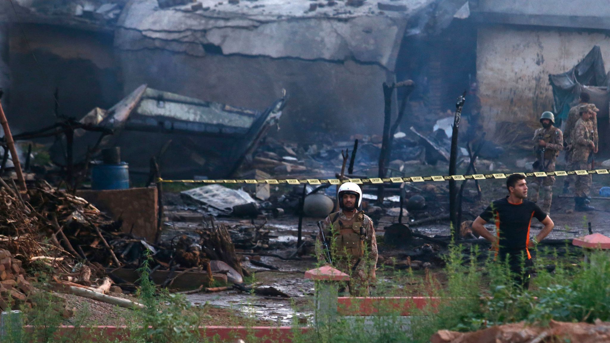 Pakistan plane: At least 17 dead as army aircraft crashes into homes in ...