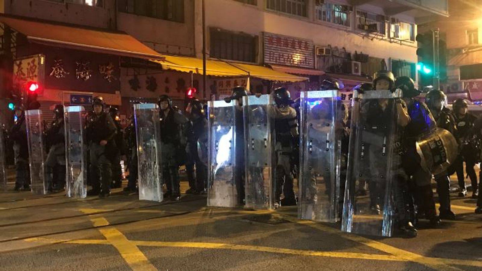 Hong Kong protests: Shoppers and tourists in one street and a riot in ...