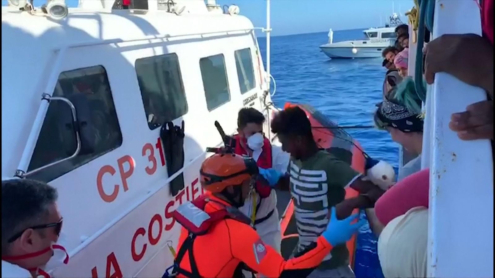 Migrant children finally allowed off stranded boat | World News | Sky News