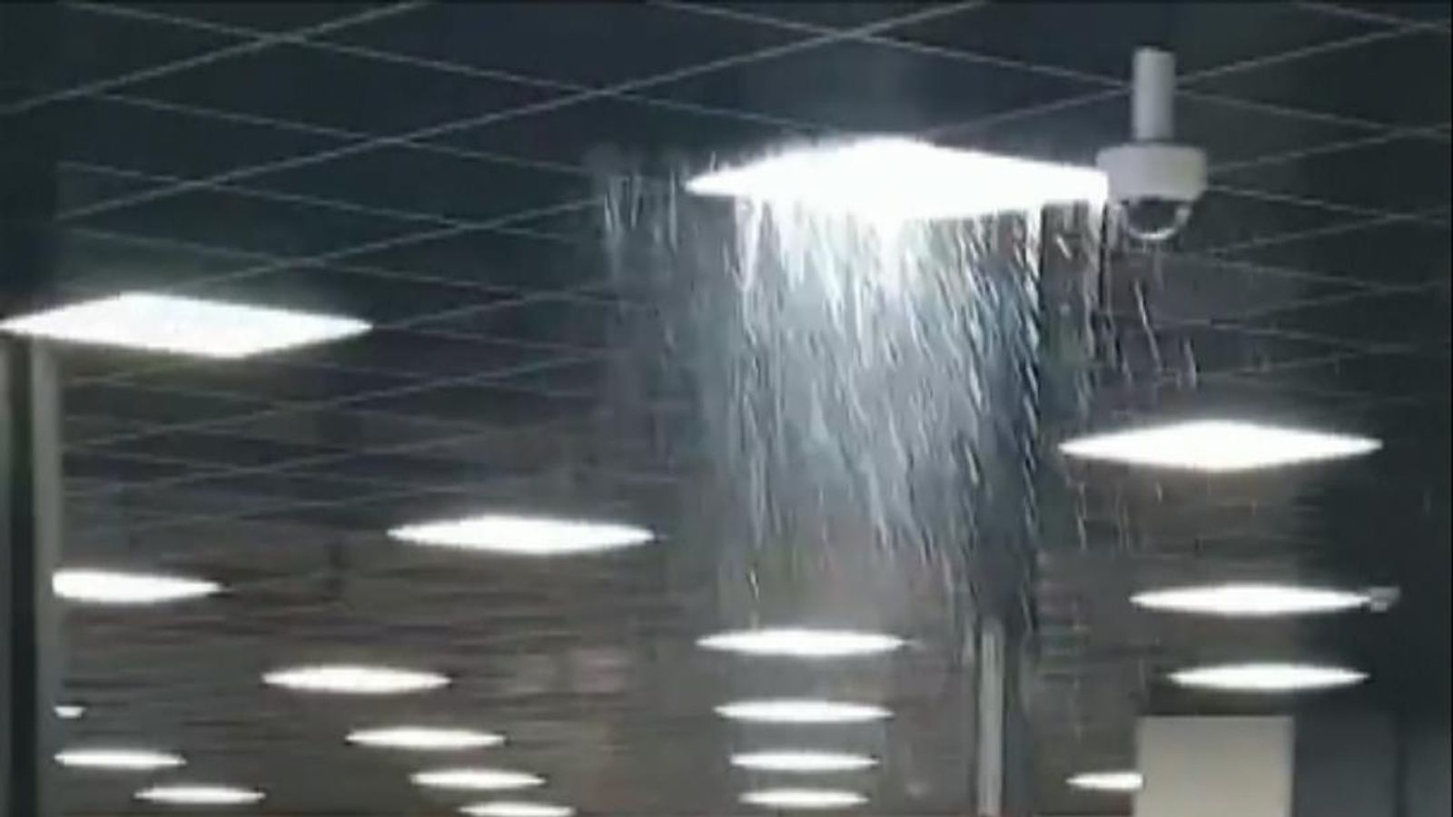 Heavy rain causes flood inside Luton AIrport terminal | UK News | Sky News