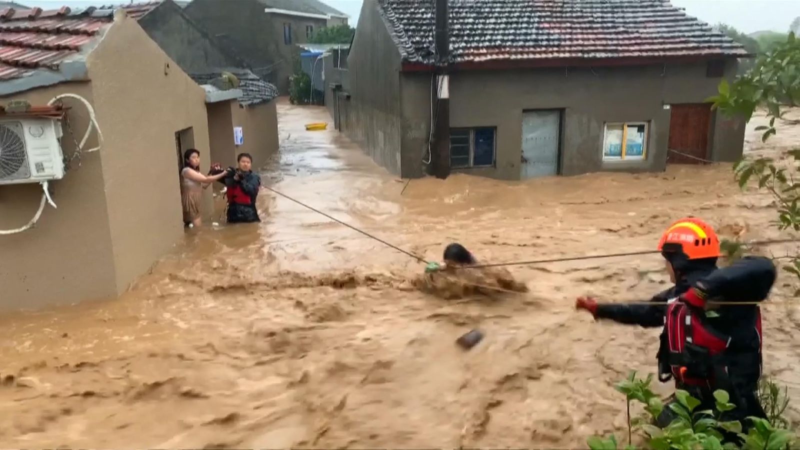 Dramatic rescues as typhoon floods homes | World News | Sky News