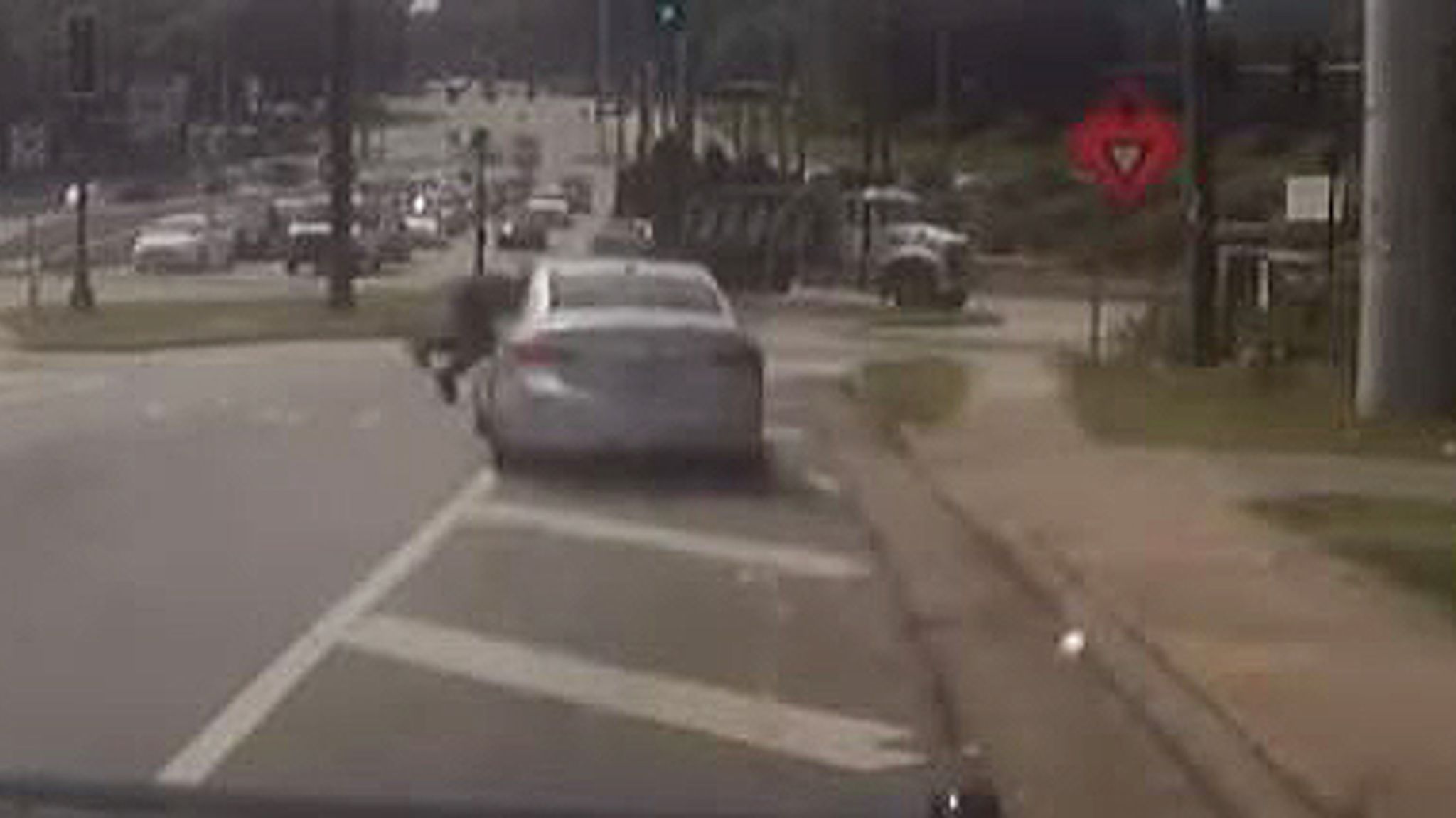 Police officer dragged out of car window during chase | US News | Sky News
