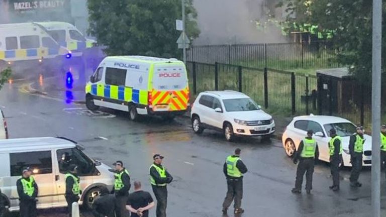 Two men arrested after riot police called in to quell 'significant ...