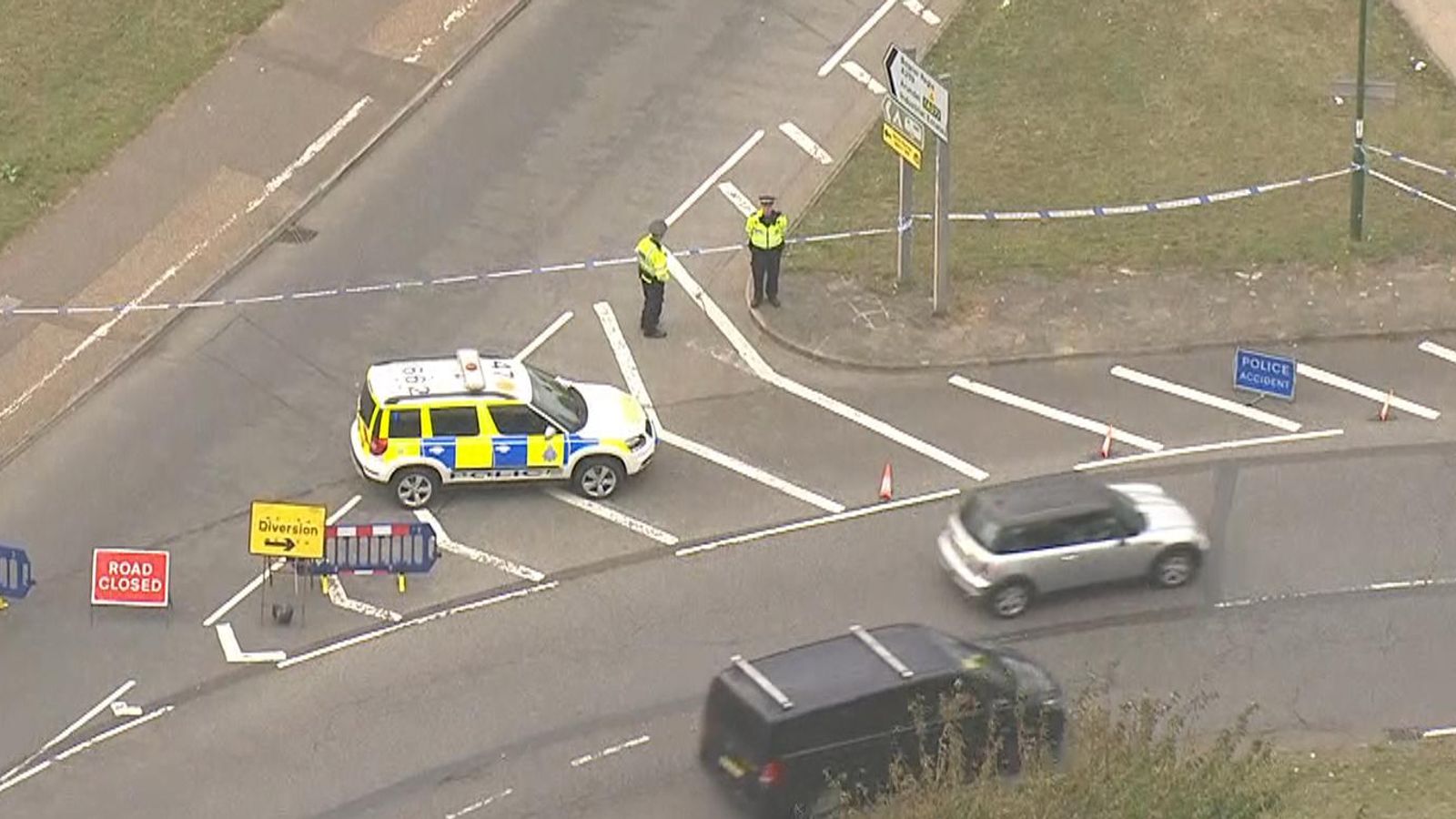 Man held on suspicion of attempted murder after two police officers hit ...