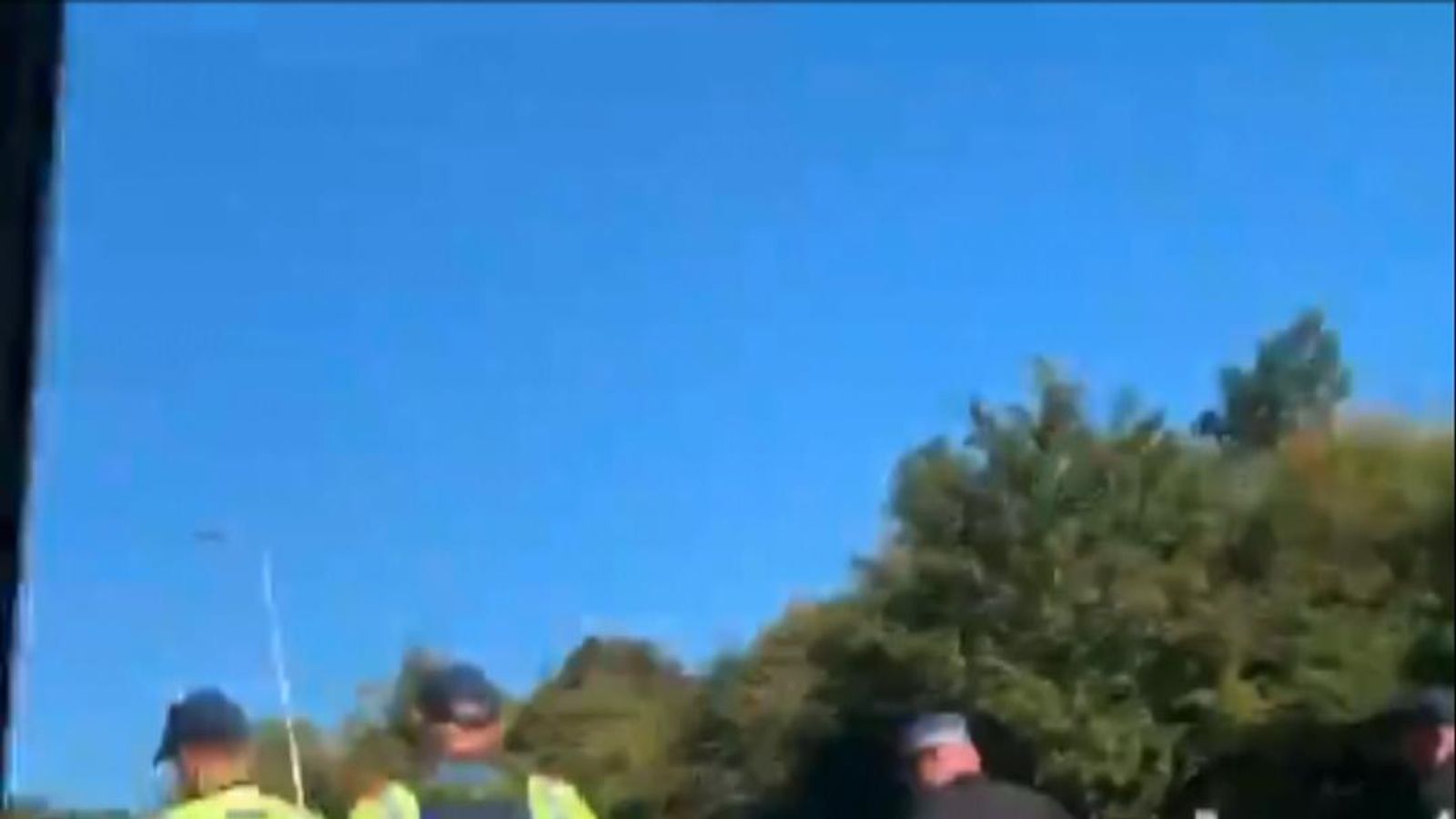 Climate activists glue themselves to A20 near Dover | Sky News