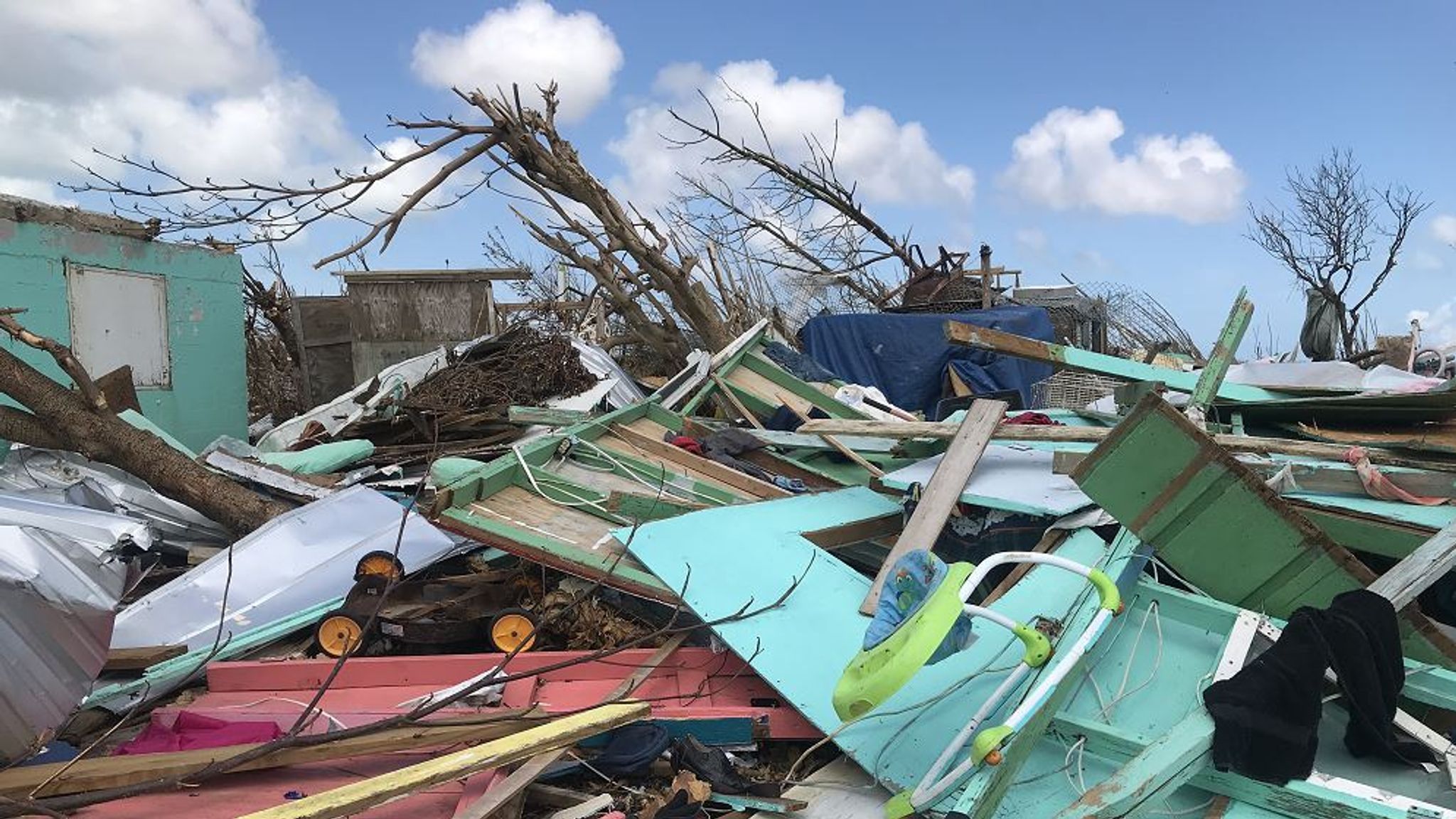 Dorian victims emerged from the rubble and waved to our helicopter ...