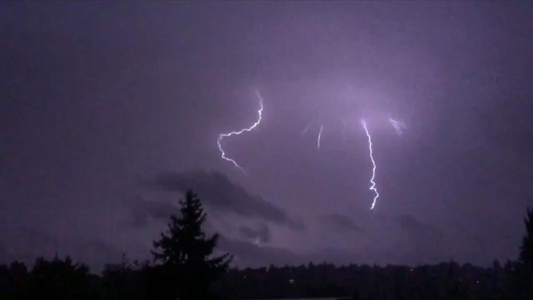 An estimated 200 lightning strikes lit the night sky over Seattle as a ...