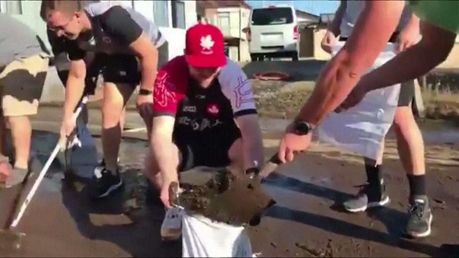 Canadian rugby team helps typhoon cleanup | World News | Sky News