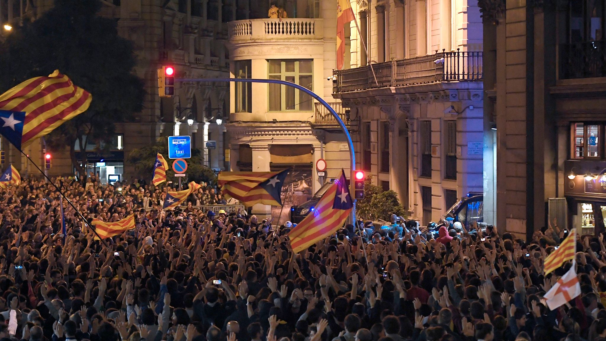 Violence as masked protesters surround police HQ in Barcelona | World ...