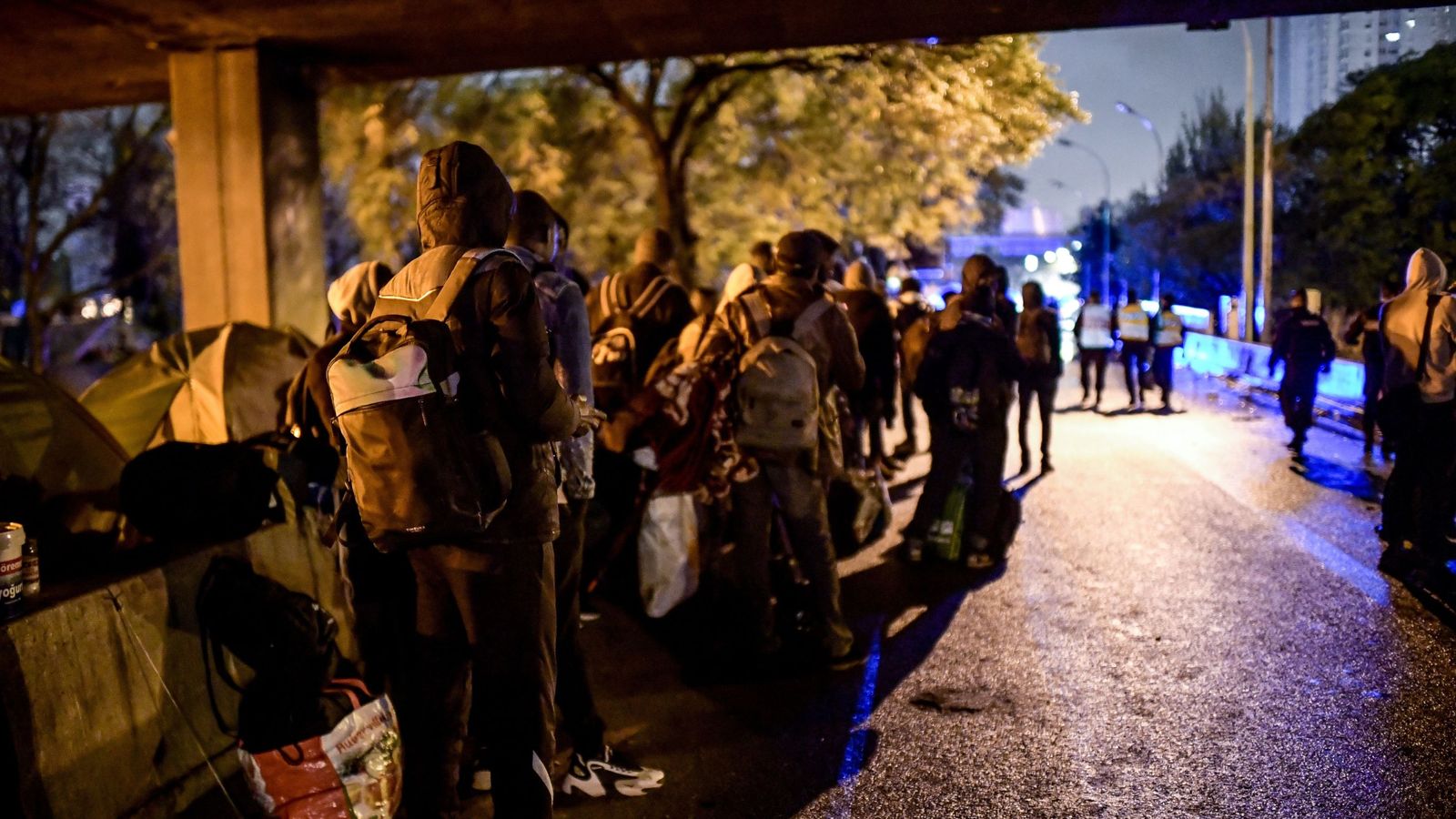 Police remove 1,600 migrants from camps under Paris flyovers | World News | Sky News