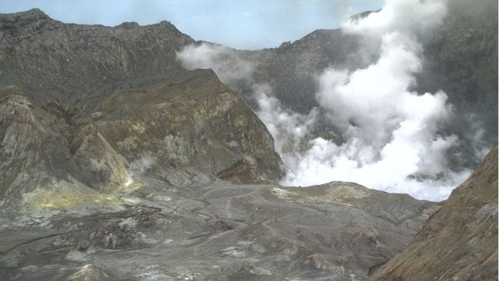 Pictured: Rescue workers scour volcano during body recovery | World ...