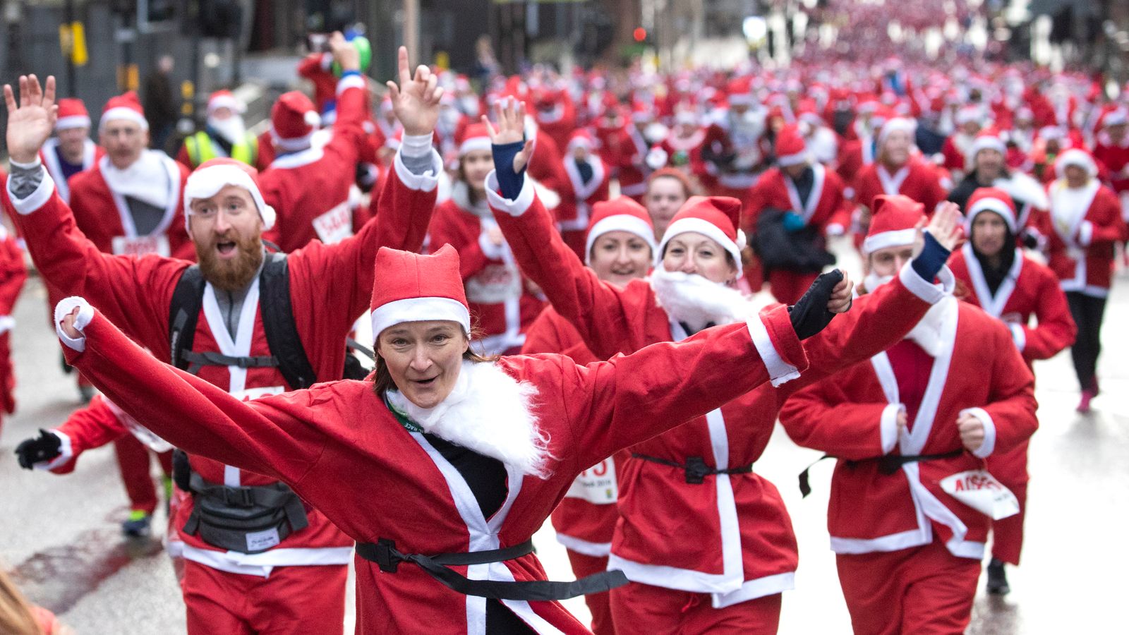 Thousands dress as Santa for charity run in Glasgow | UK News | Sky News