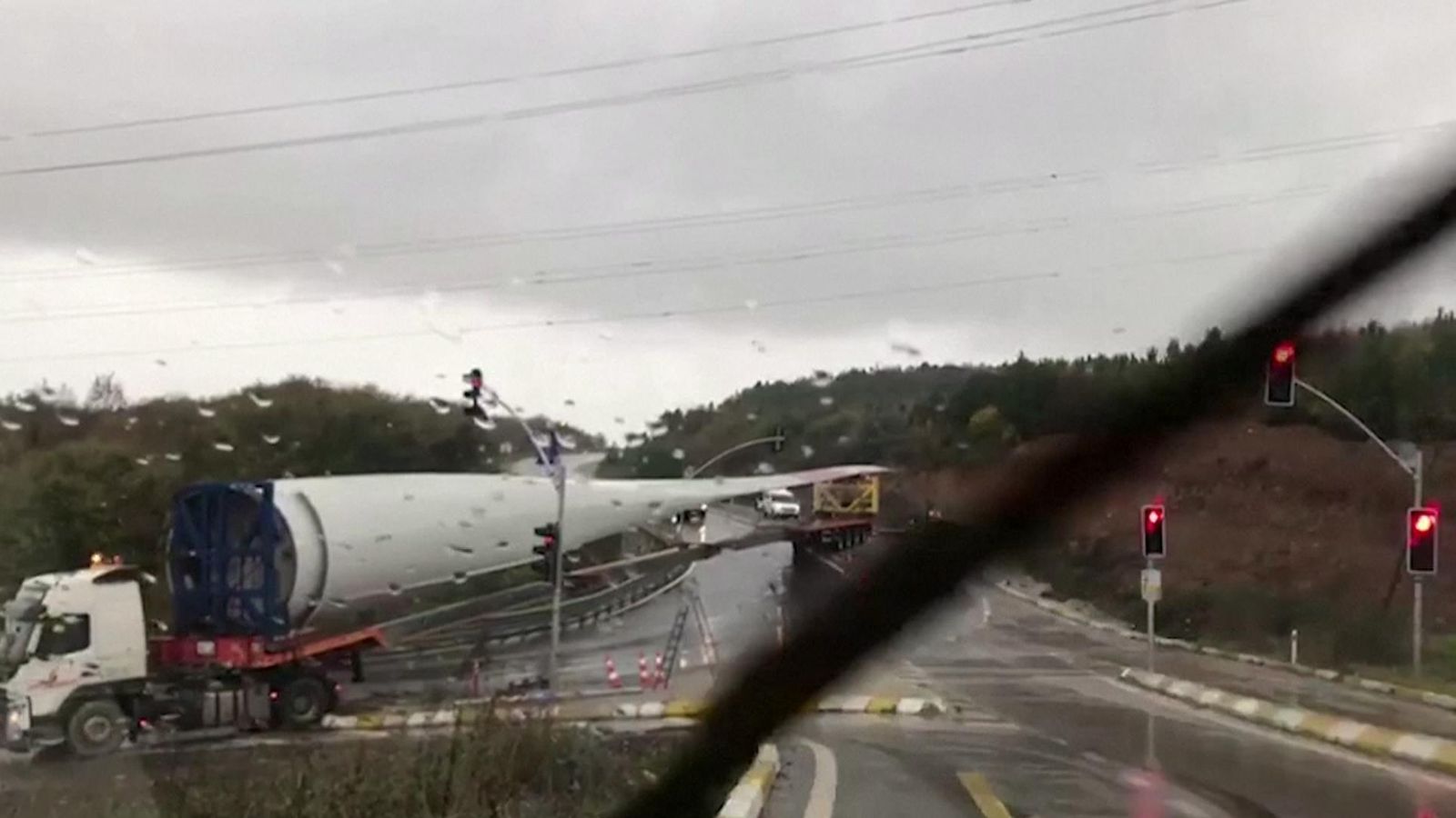 Truck overturns carrying wind turbine blade | World News | Sky News