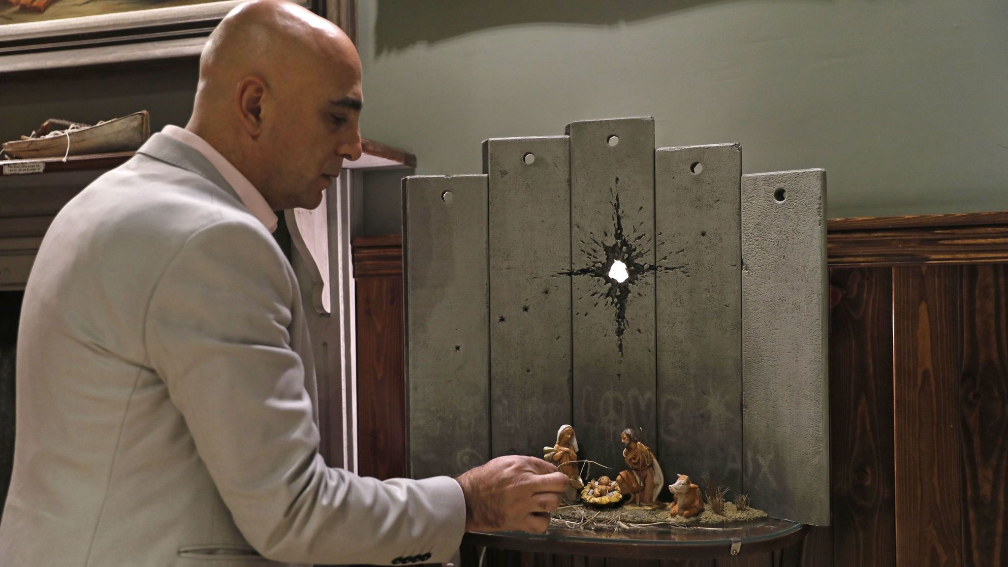 Banksy 'nativity' appears at his Walled Off Hotel in Bethlehem | World ...