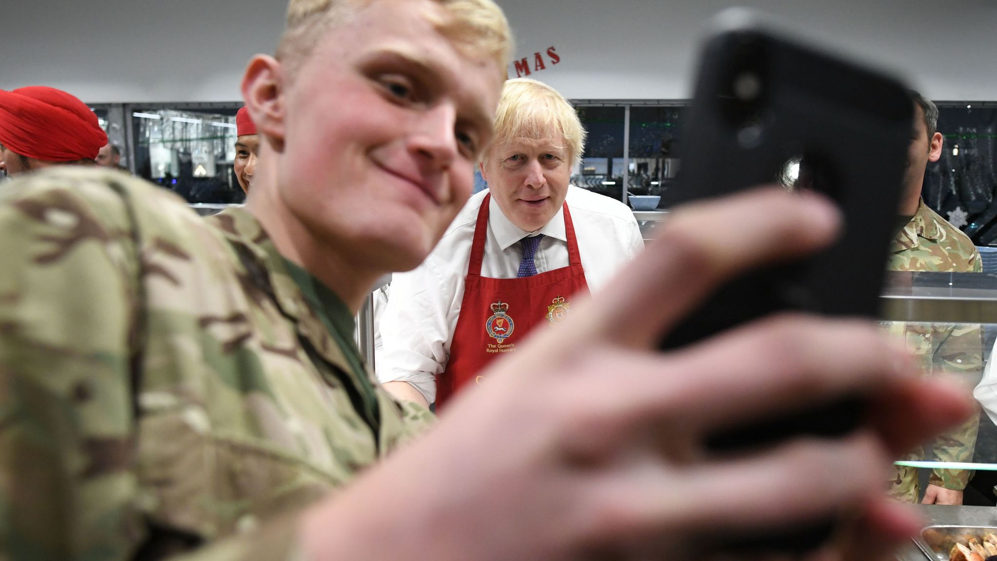 Boris Johnson thanks British troops in Estonia by serving them ...