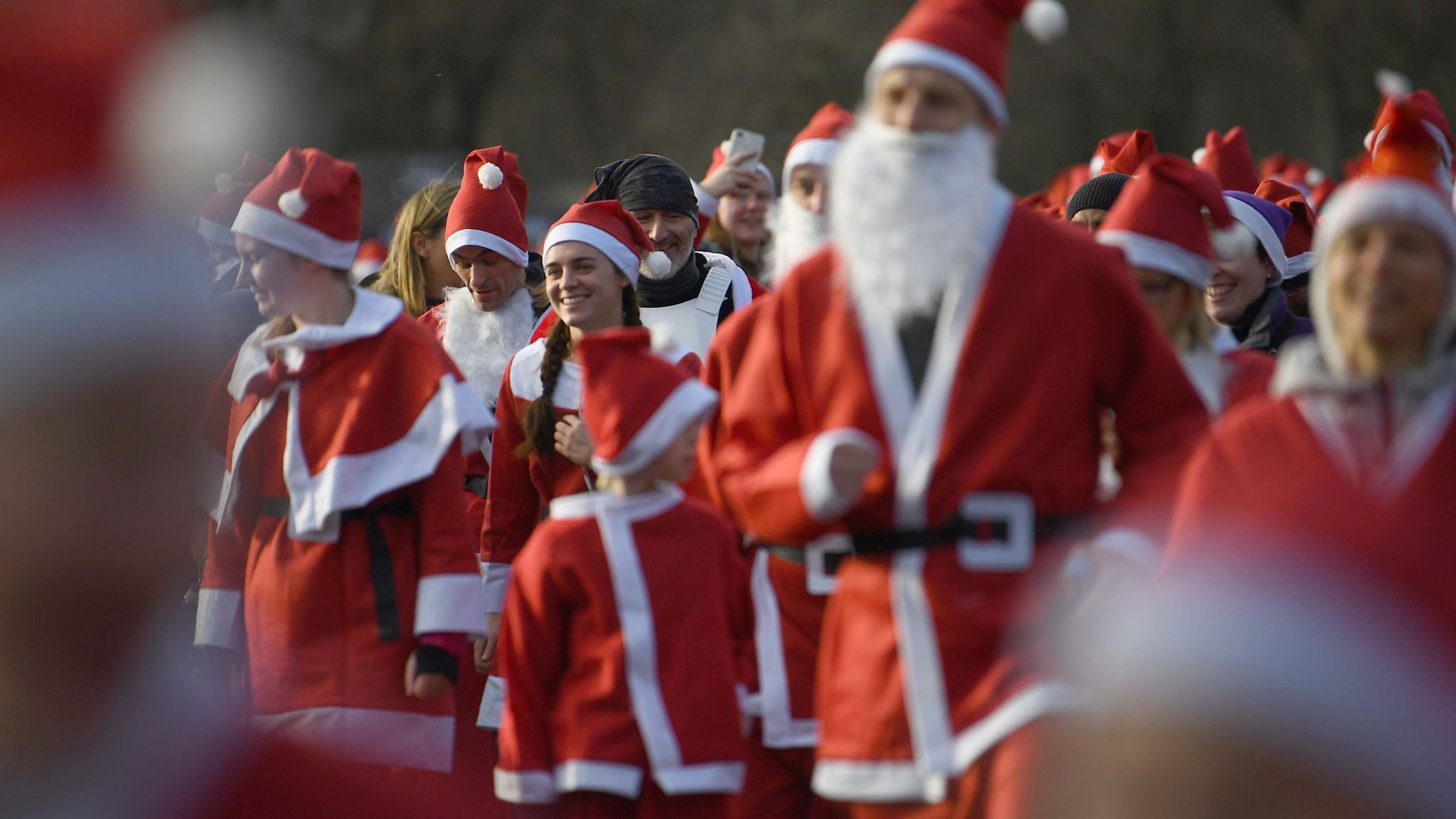 Thousands take part in biggest ever Santa Run in London | UK News | Sky ...