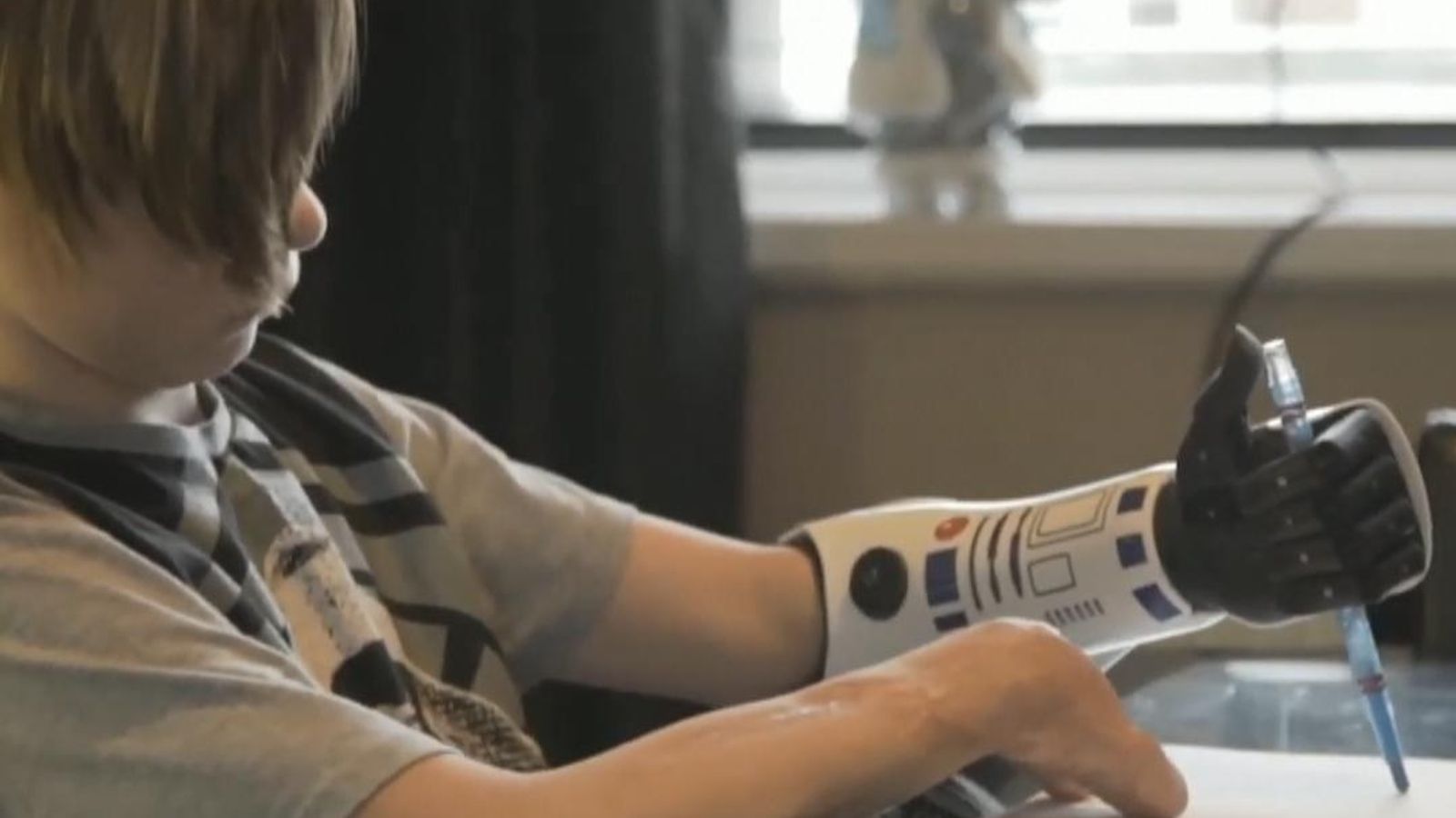 Boy tries out Star Wars themed bionic 'hero arm' | Science, Climate ...