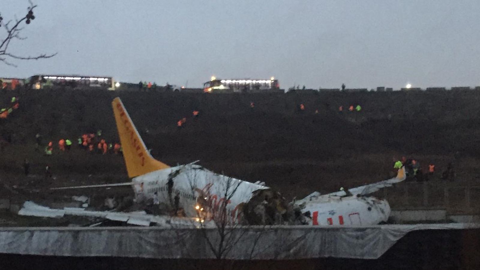 Plane splits in three after skidding off runway, leaving three dead and ...