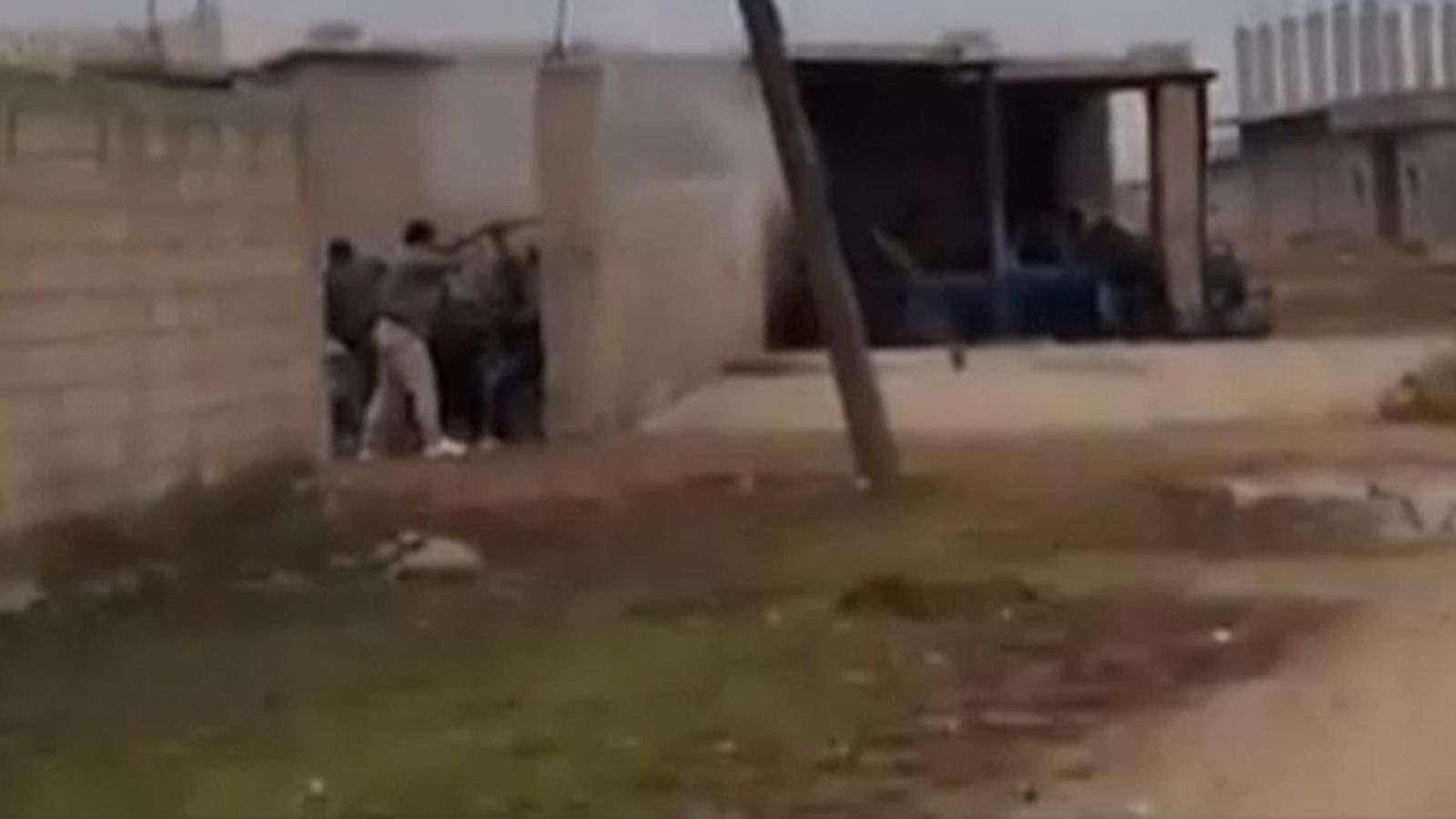 Villagers fire guns at US troops during a clash near a checkpoint in ...