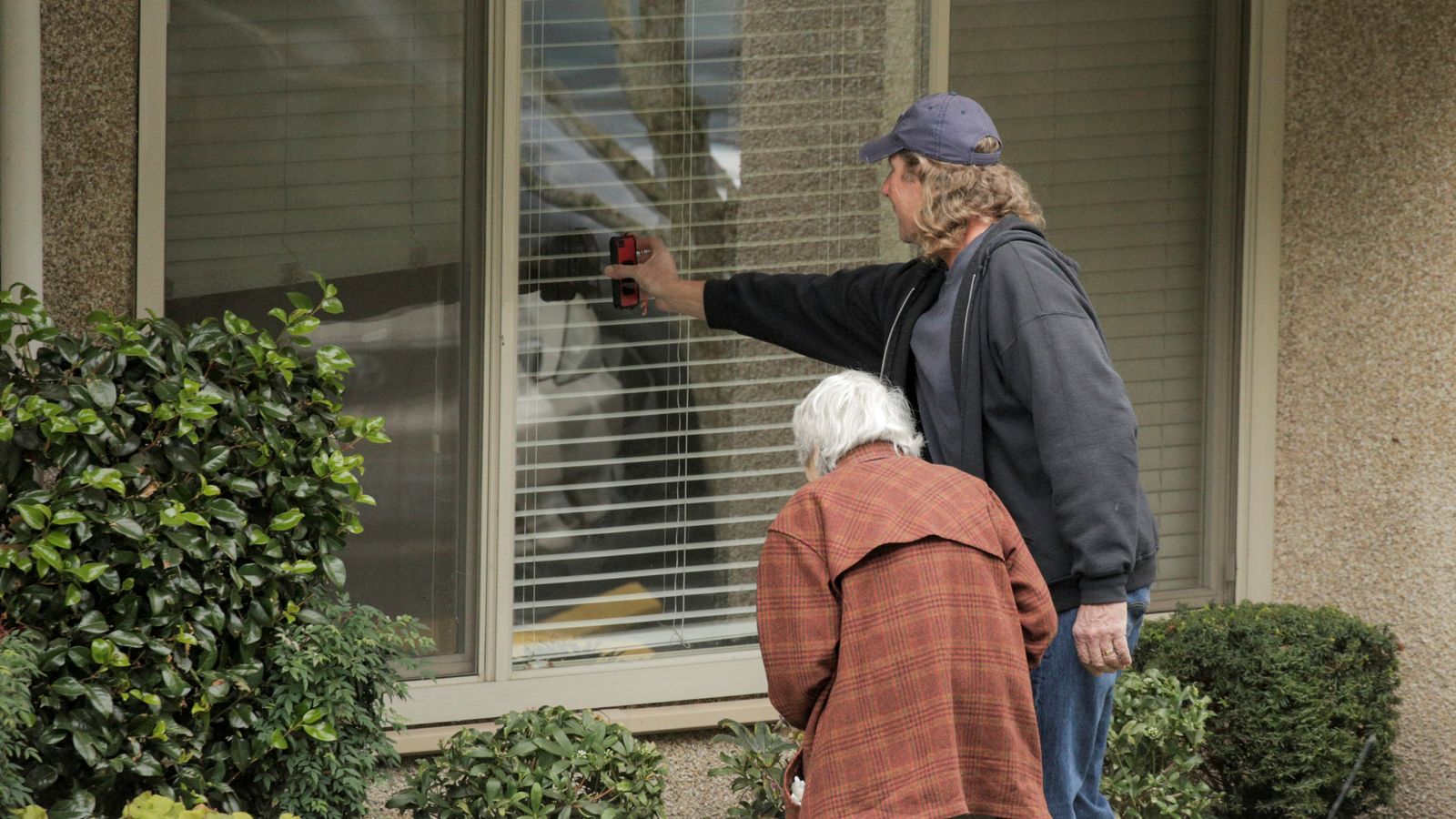 Coronavirus: Couple married for 60 years forced to talk through window ...
