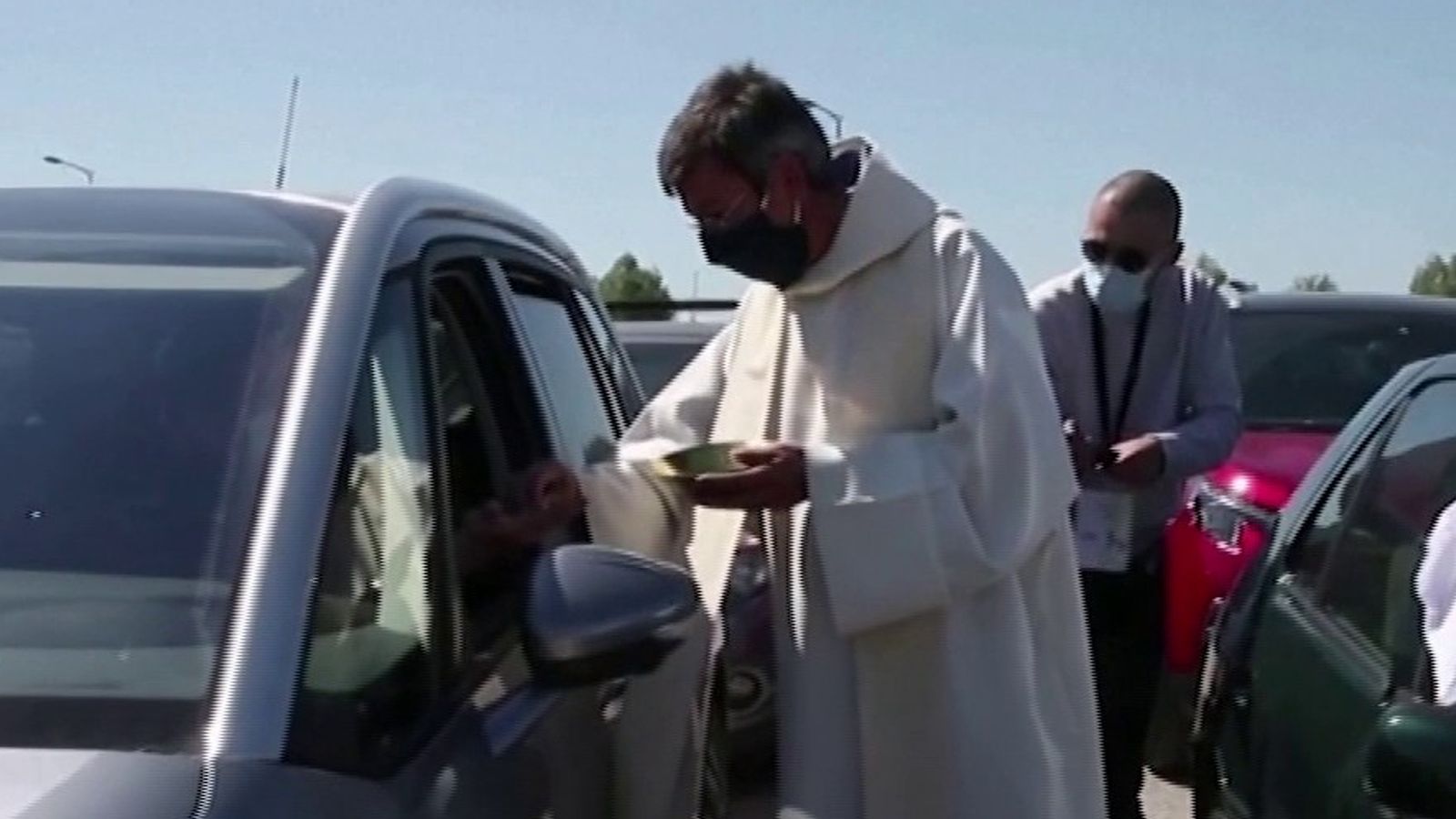 Coronavirus: Catholics receive drive-in communion in France | World ...