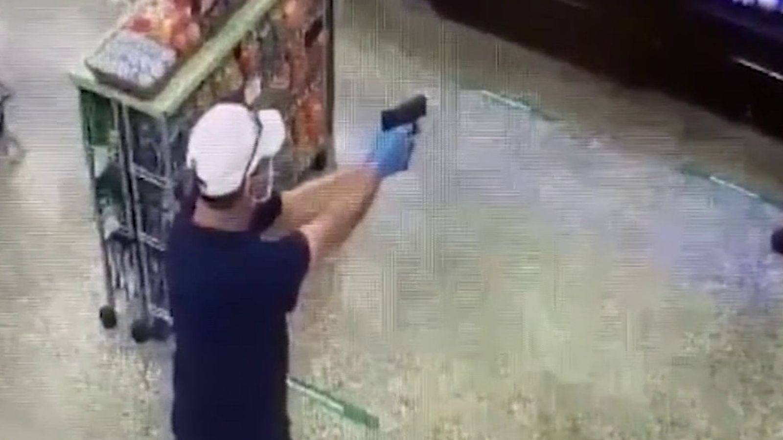 CCTV: Man pulls gun on customer at delicatessen counter in US ...