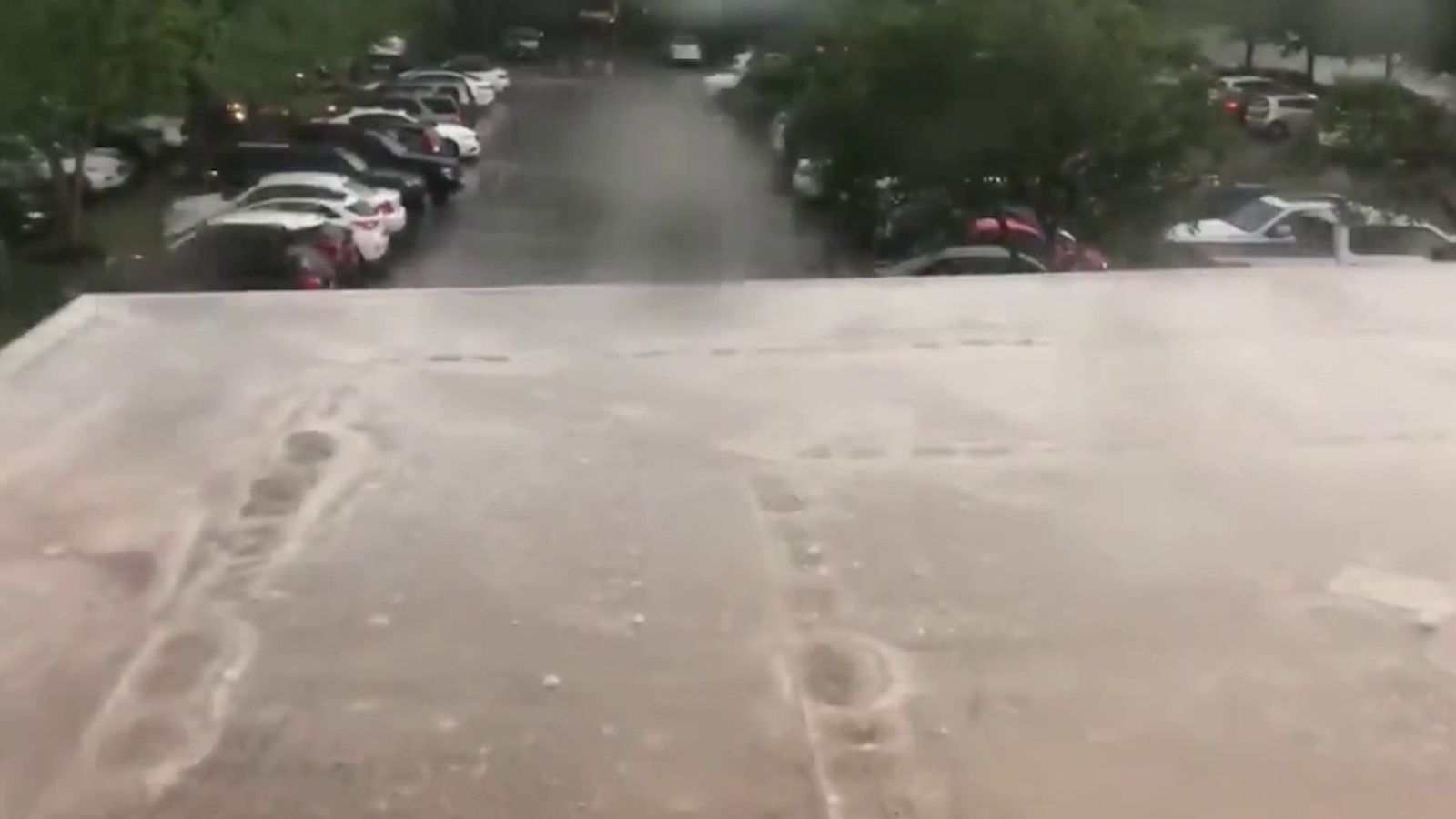 Listen to (and see) extreme hail battering building | US News | Sky News