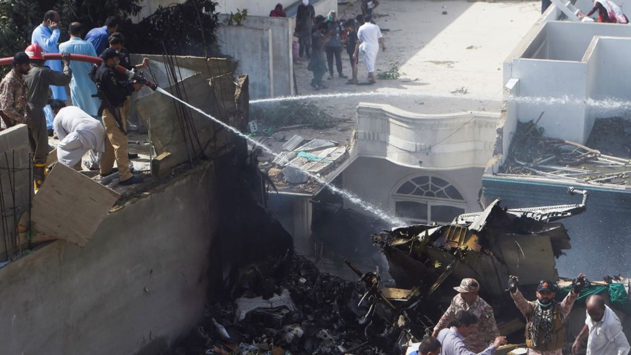 Pakistan plane crash: At least two survivors after aircraft carrying 98 ...
